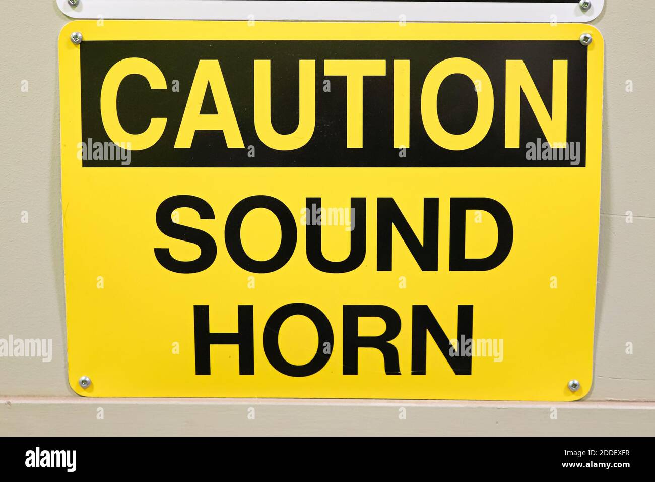Closeup of a Caution Sound Horn warning sign Stock Photo - Alamy