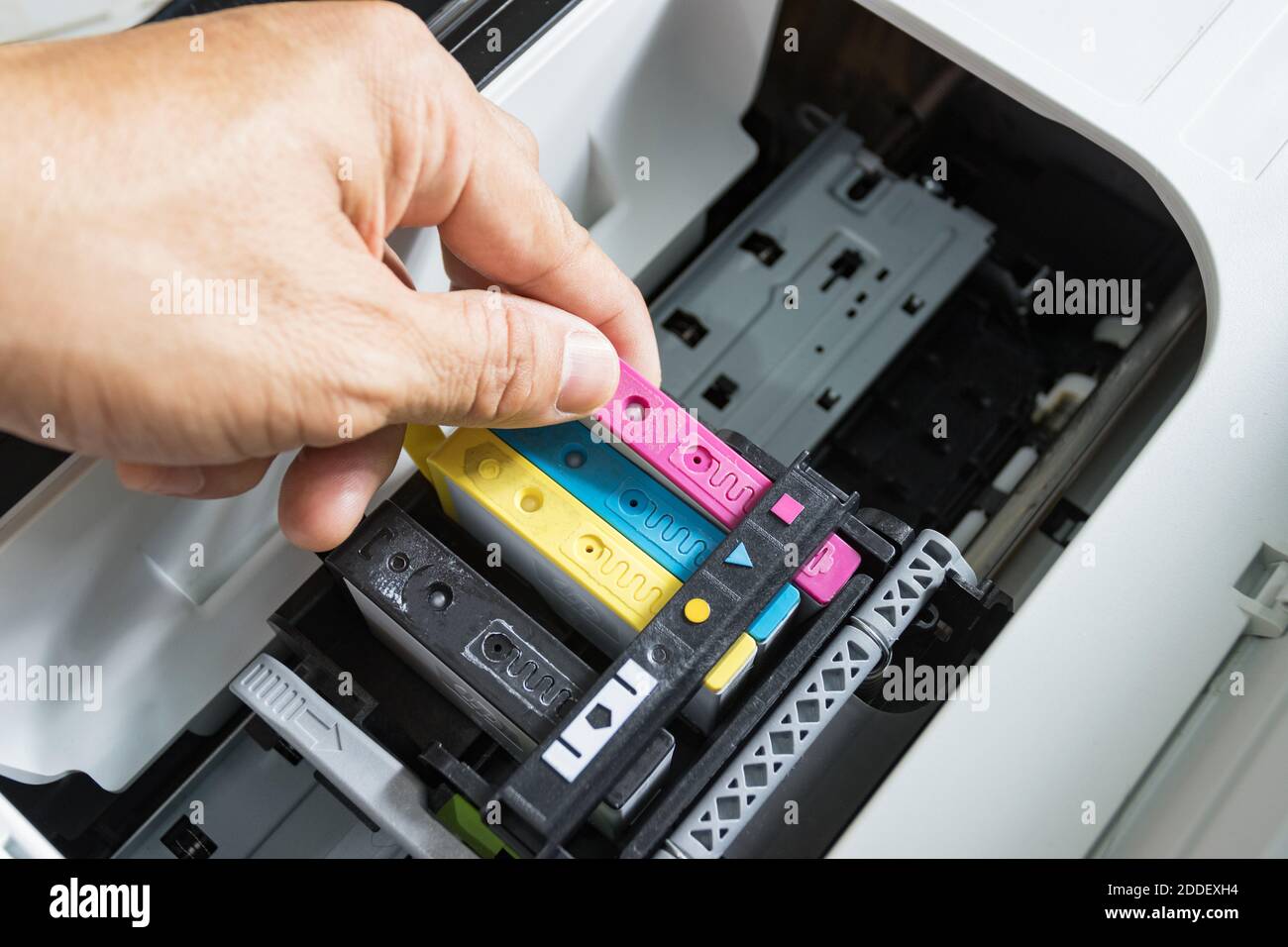 Technicians are install setup the ink cartridge of a inkjet printer the ...