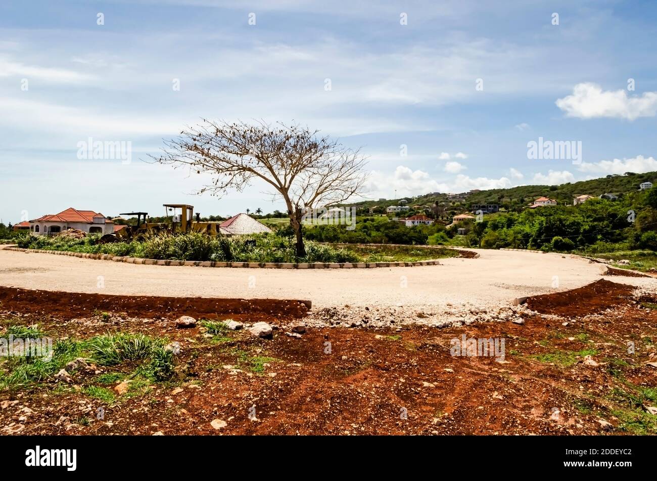A single side view of a roundabout of a road that is under construction ...
