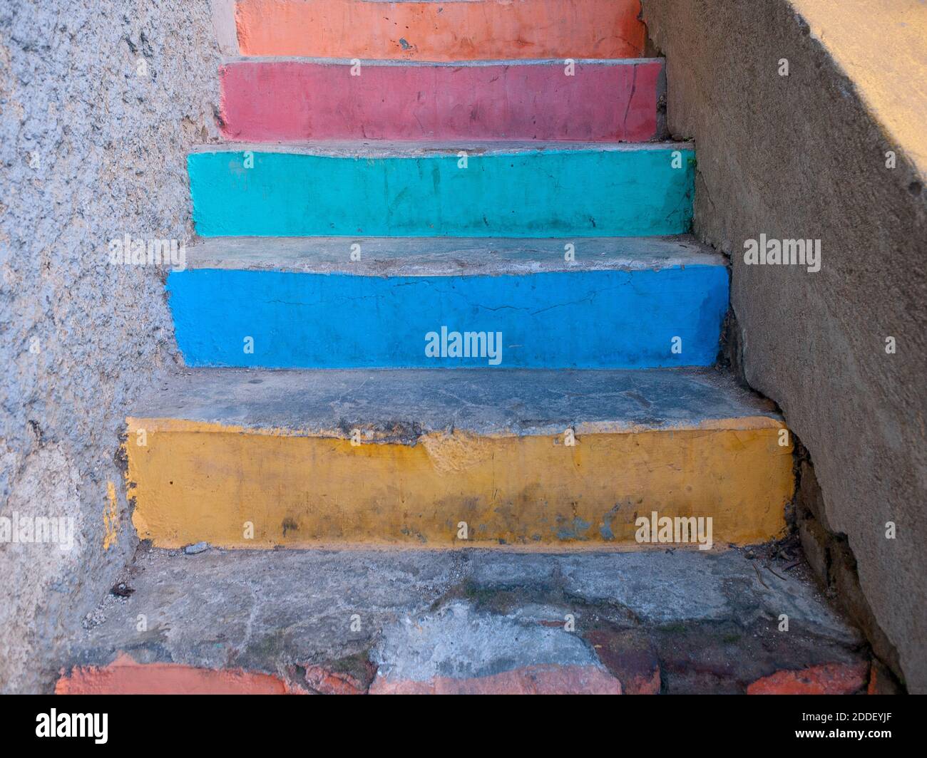 Brightly colored stairs worn over time by footsteps in Valparaiso Chile ...