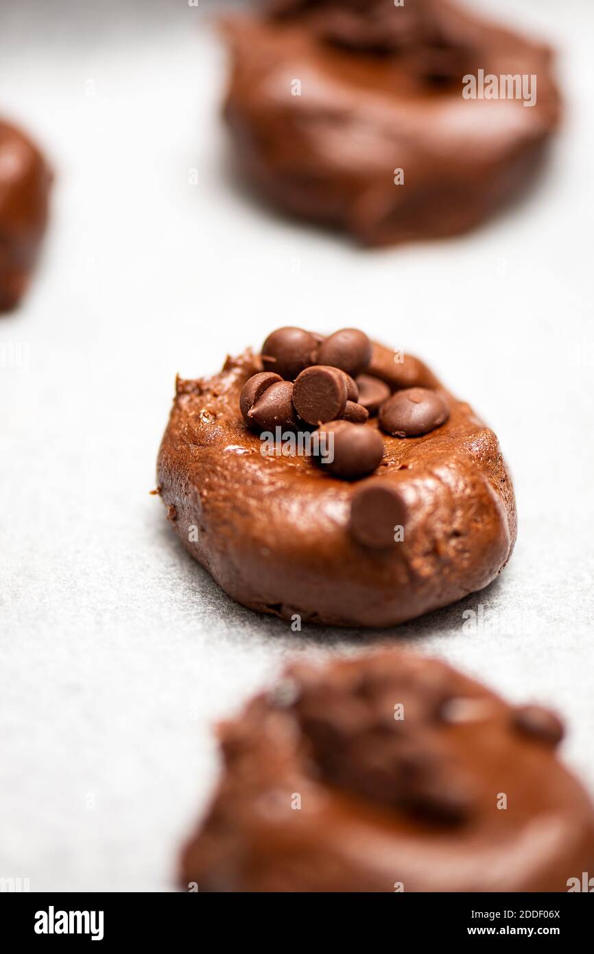 Classic chocolate chip cookies being prepared before baking, food ...