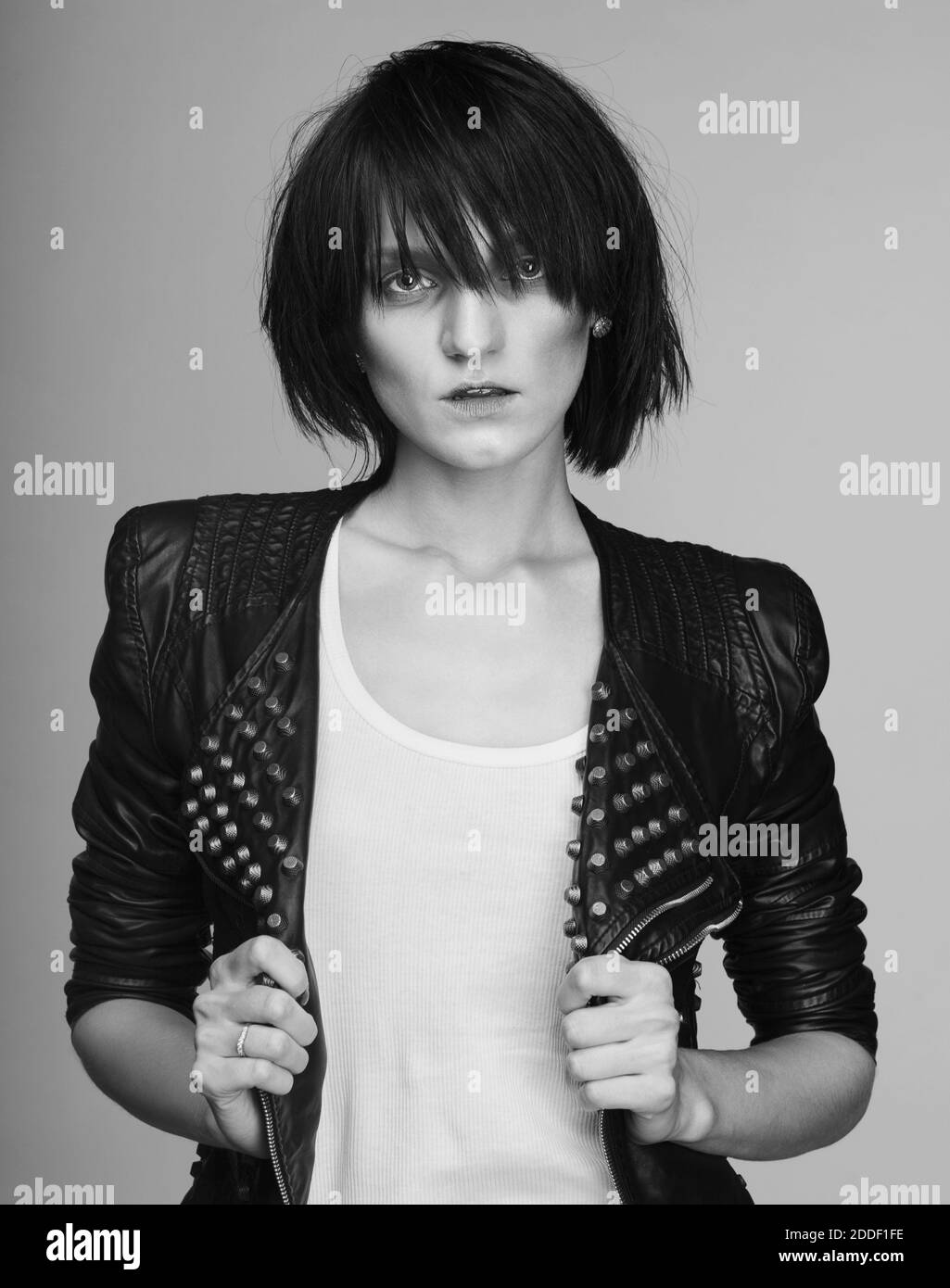 Androgyny female model in Heroin chic style. Old style tinted image ...