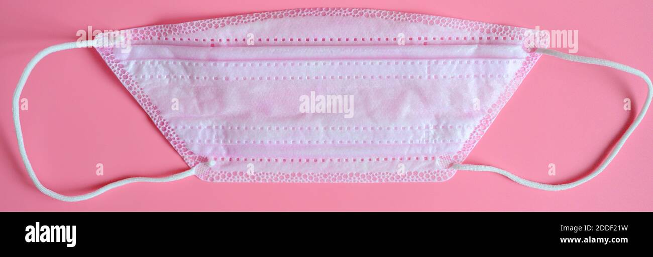 medical mask pink color to cover the mouth and nose for protection from ...