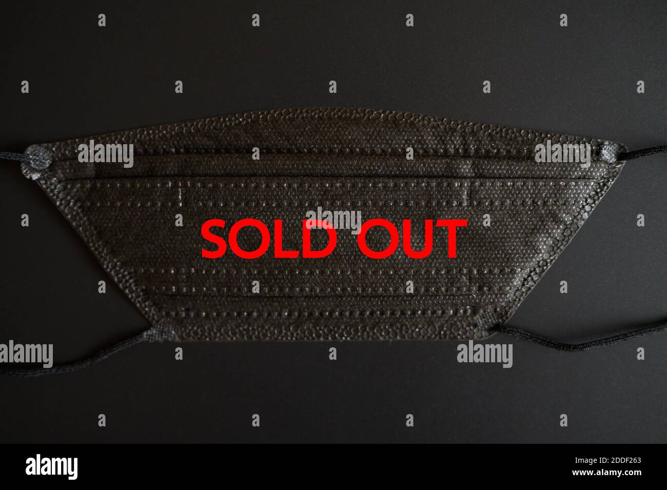 medical mask black color with text "sold out" on a black background ...