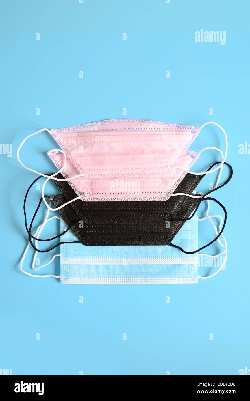medical masks blue, black and pink colors to cover the mouth and nose ...