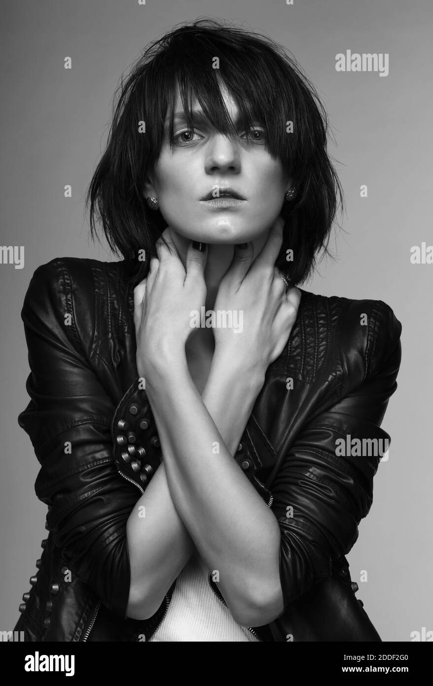 Androgyny female model in Heroin chic style. Old style tinted image ...