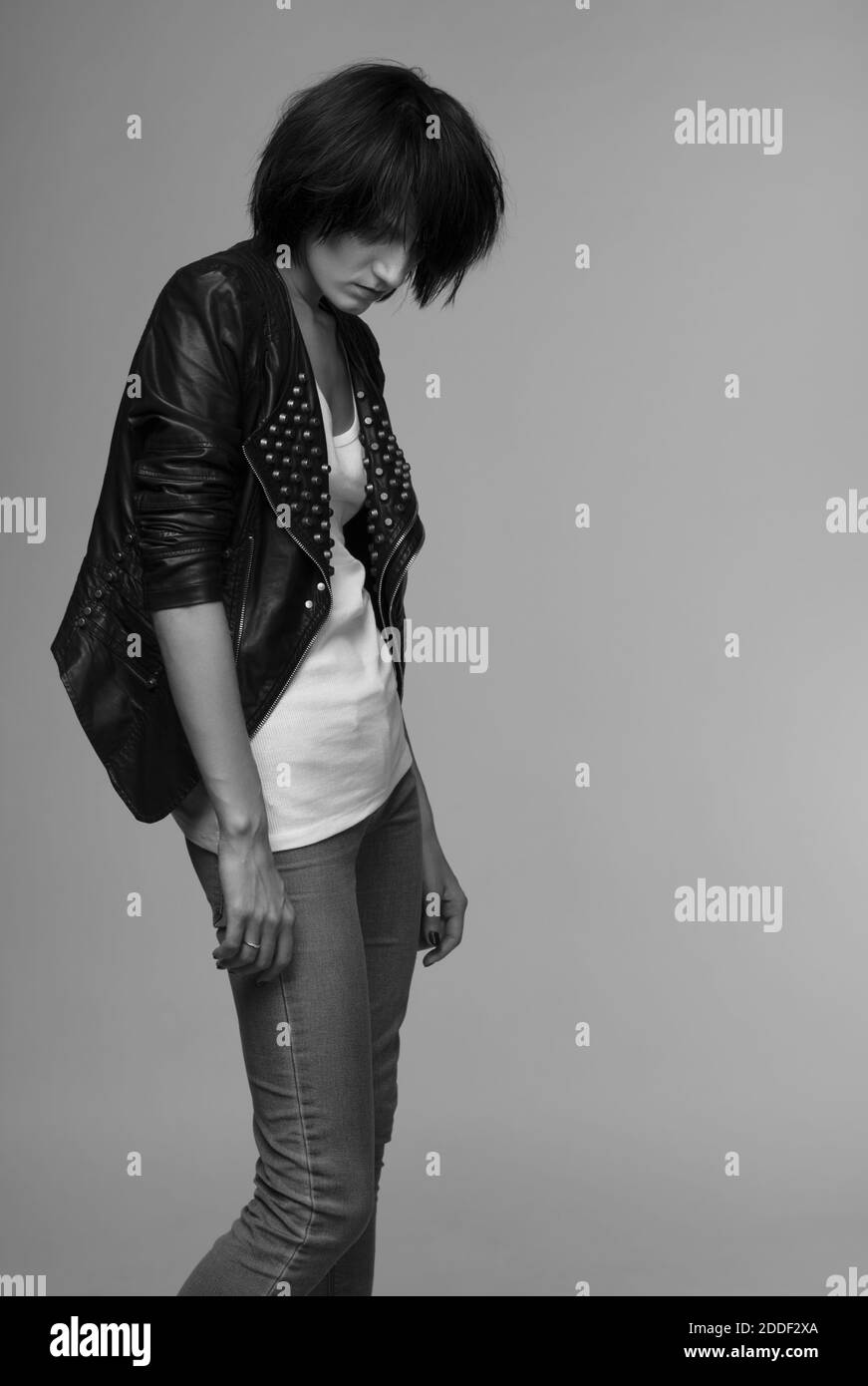 Androgyny female model in Heroin chic style. Old style tinted image ...