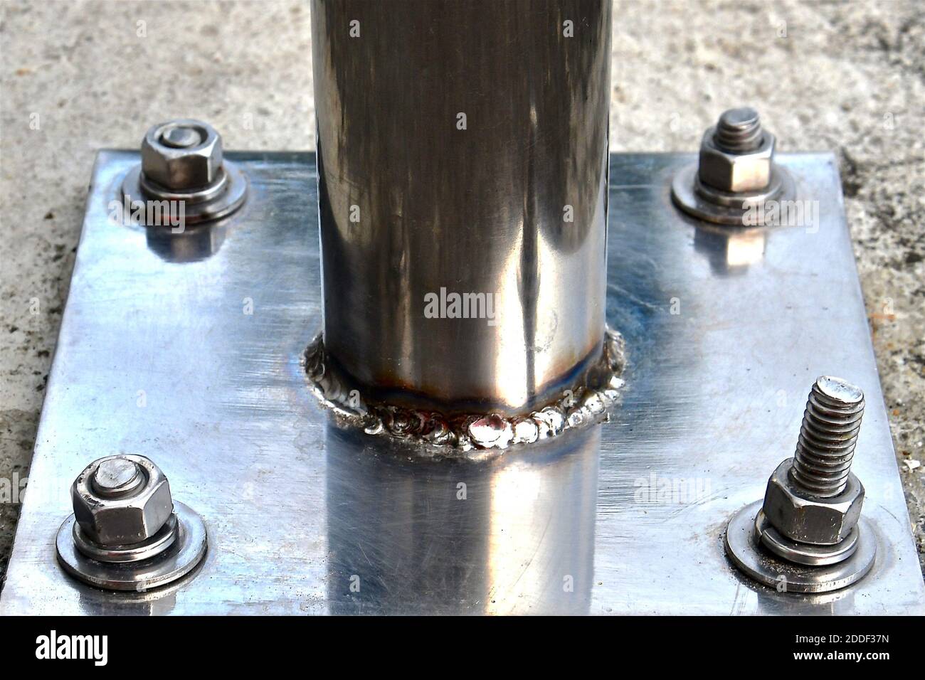 Side perspective view of a stainless steel plate with industrial size ...