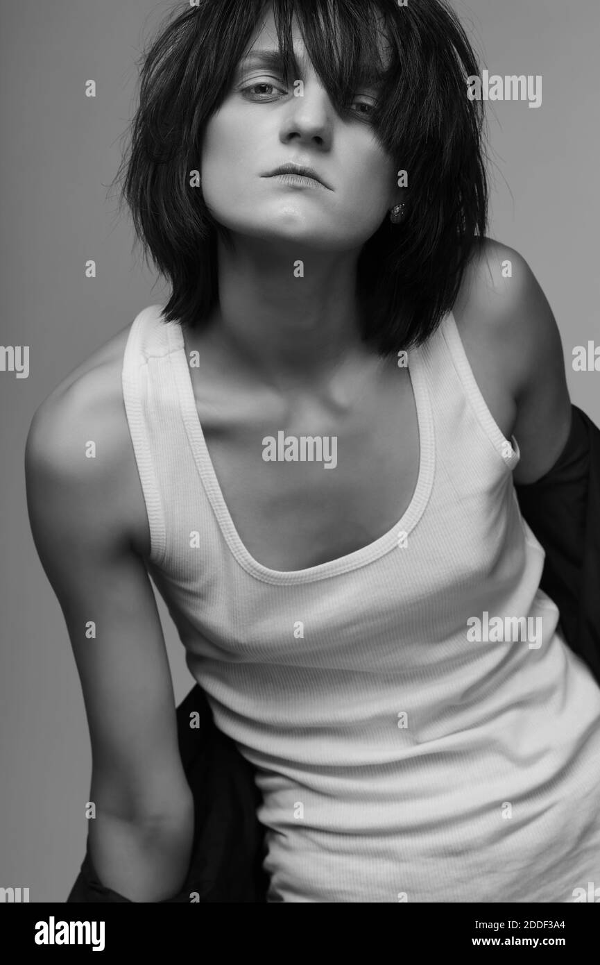 Androgyny female model in Heroin chic style. Old style tinted image ...