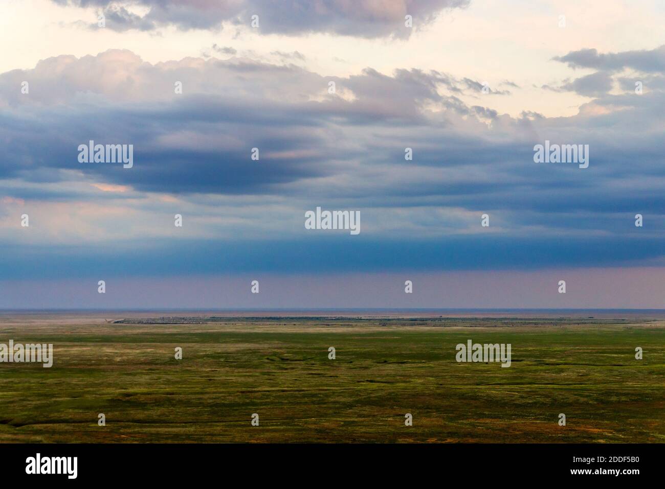 Scenic sunset with clouds in sky in steppe Stock Photo - Alamy