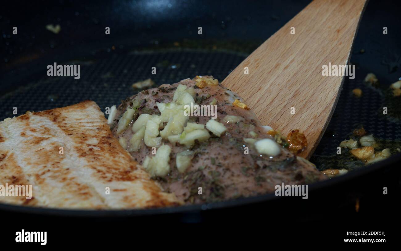 Cooking salmon into a pan for lunch in germany Stock Photo - Alamy
