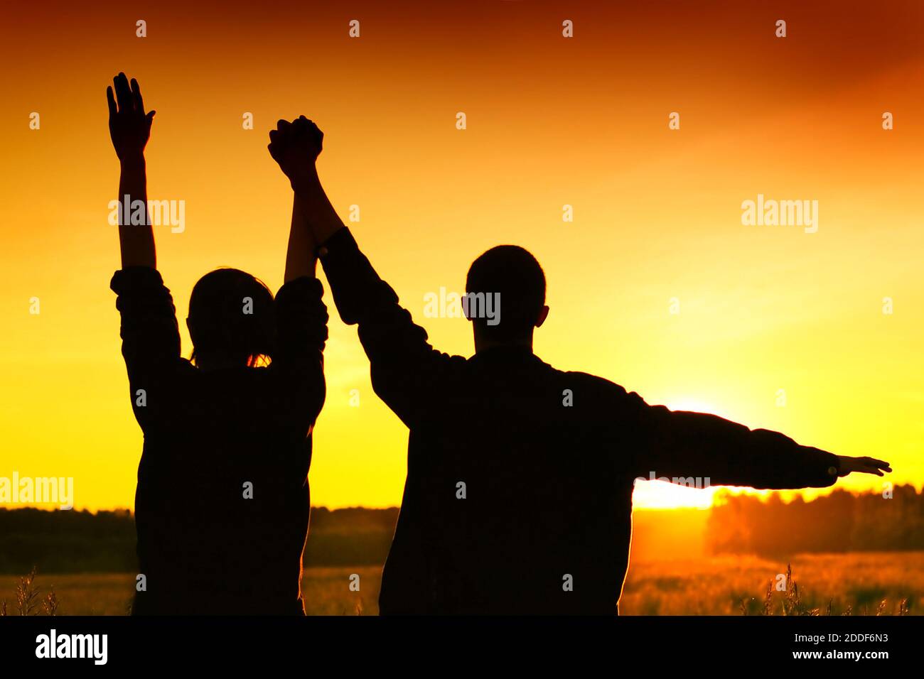 Toned Photo of Silhouette of a Two Happy Friends on Sunset Stock Photo ...