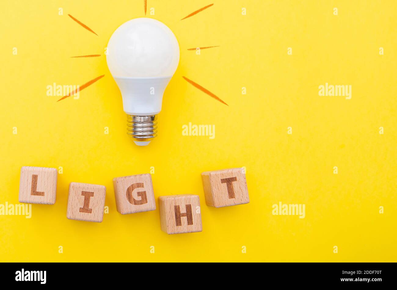 Word Light and light bulb on yellow background, concept picture, layout ...