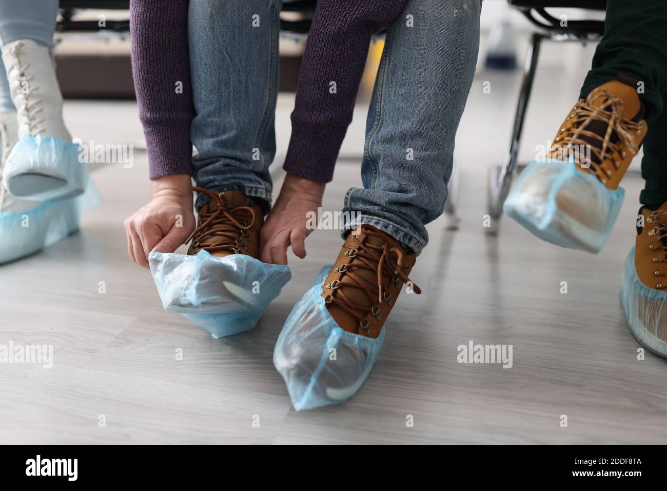 Legs of people sitting in line in medical bakalas. Finding people ...
