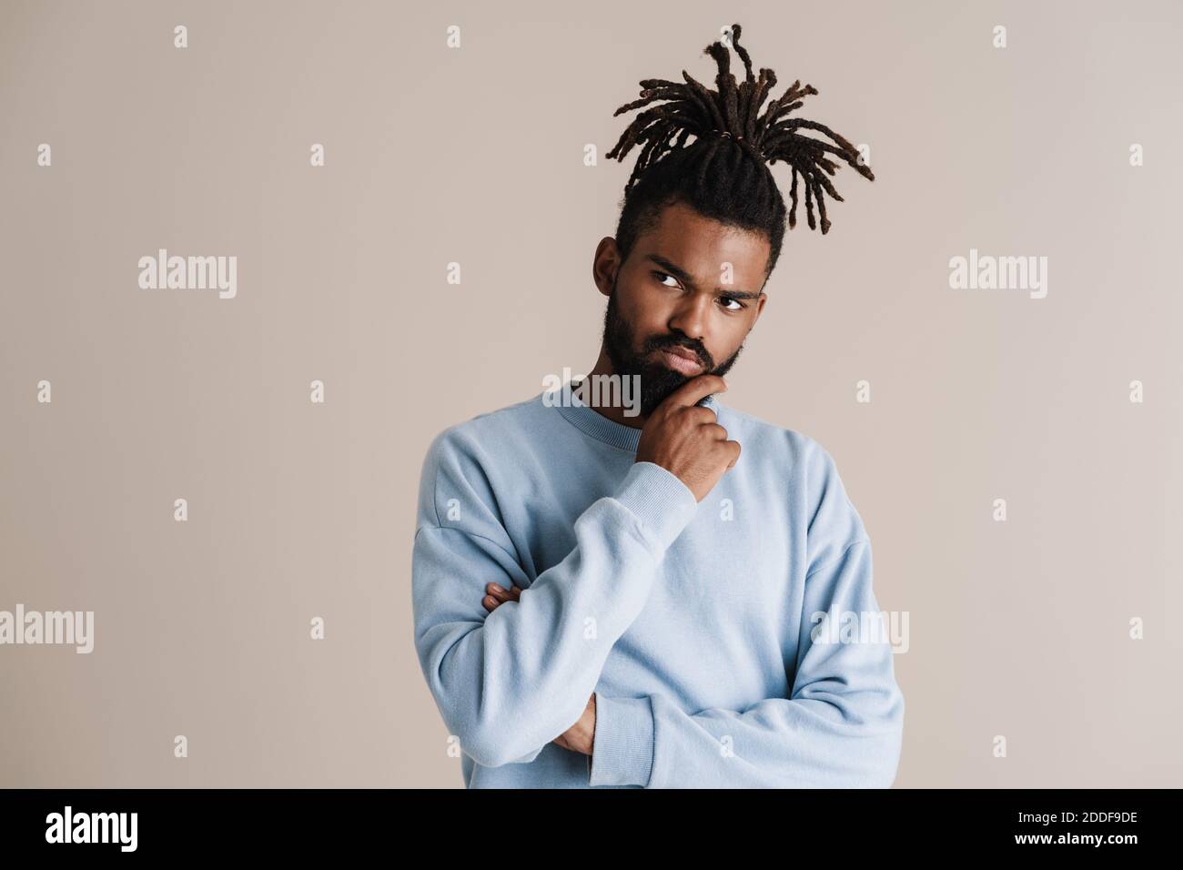 Brooding african american guy thinking and looking aside isolated over ...