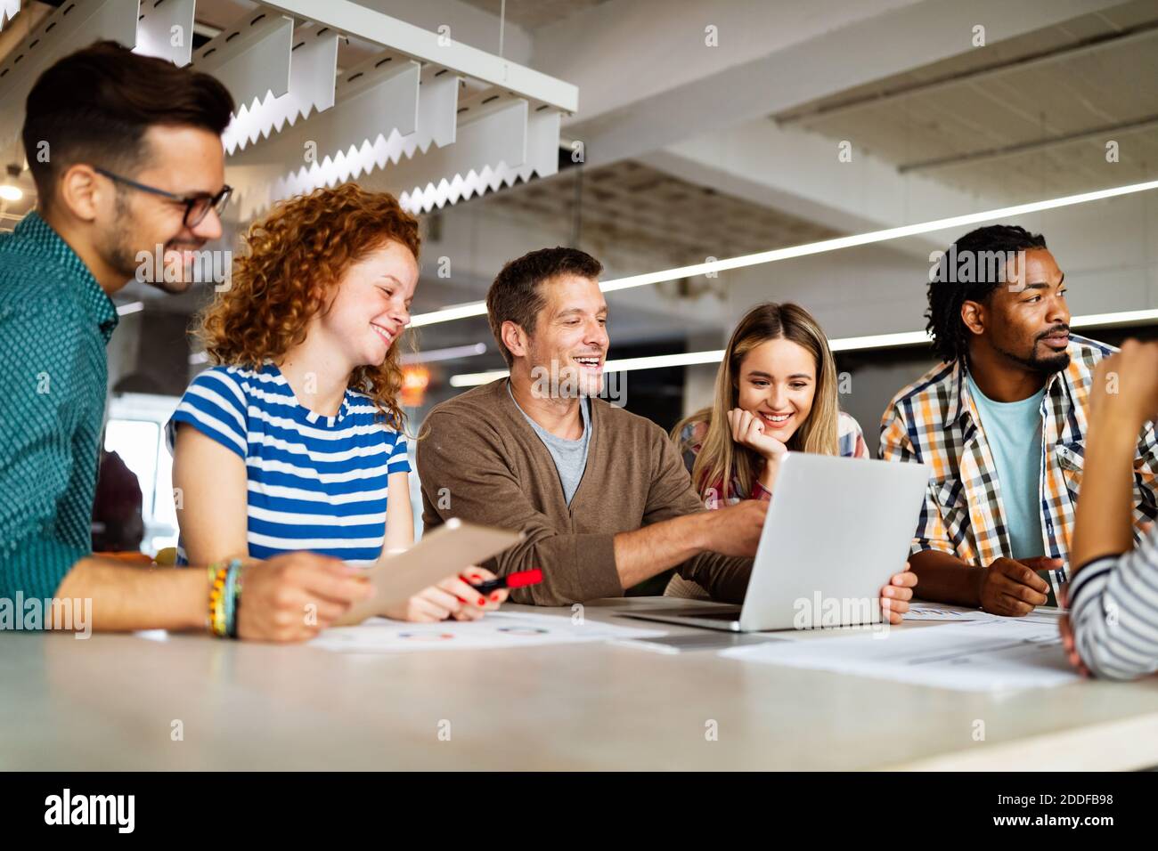 Happy creative team in office. Business, startup, design, people and ...