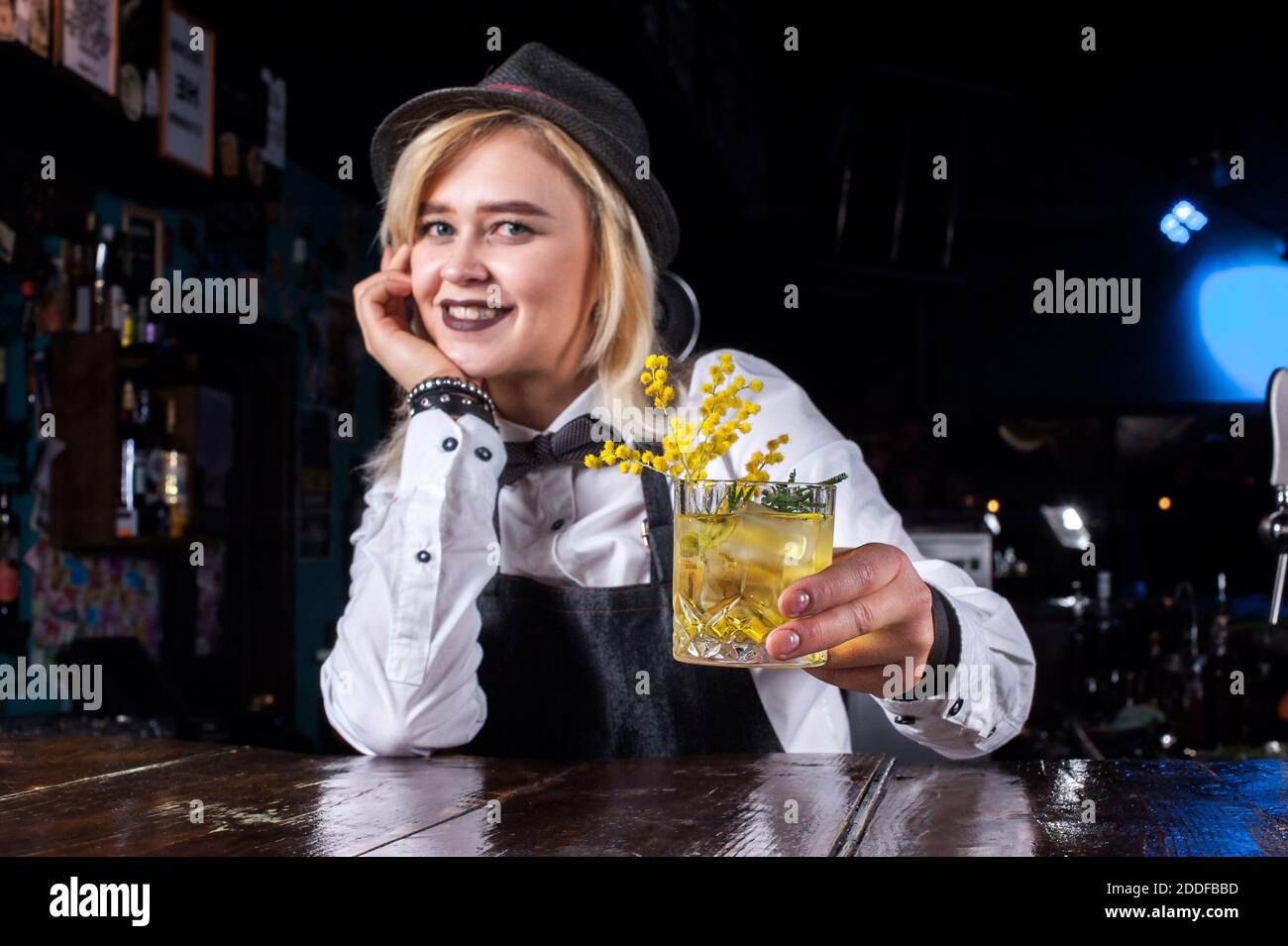 Expert girl bartending surprises with its skill bar visitors in the pub Stock Photo - Alamy