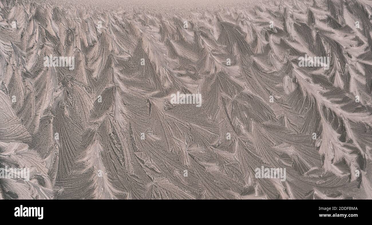 Frost drawing on window glass, snowflake ornament after anomaly ice ...