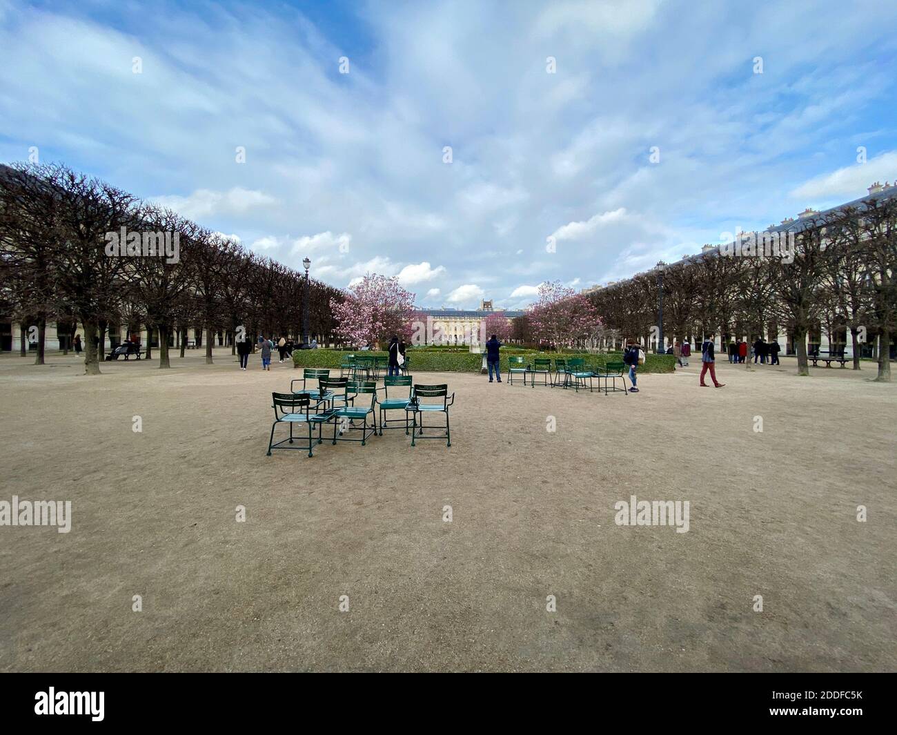 Wide angle panoramic park inside city surrounded with trees. Walkway ...