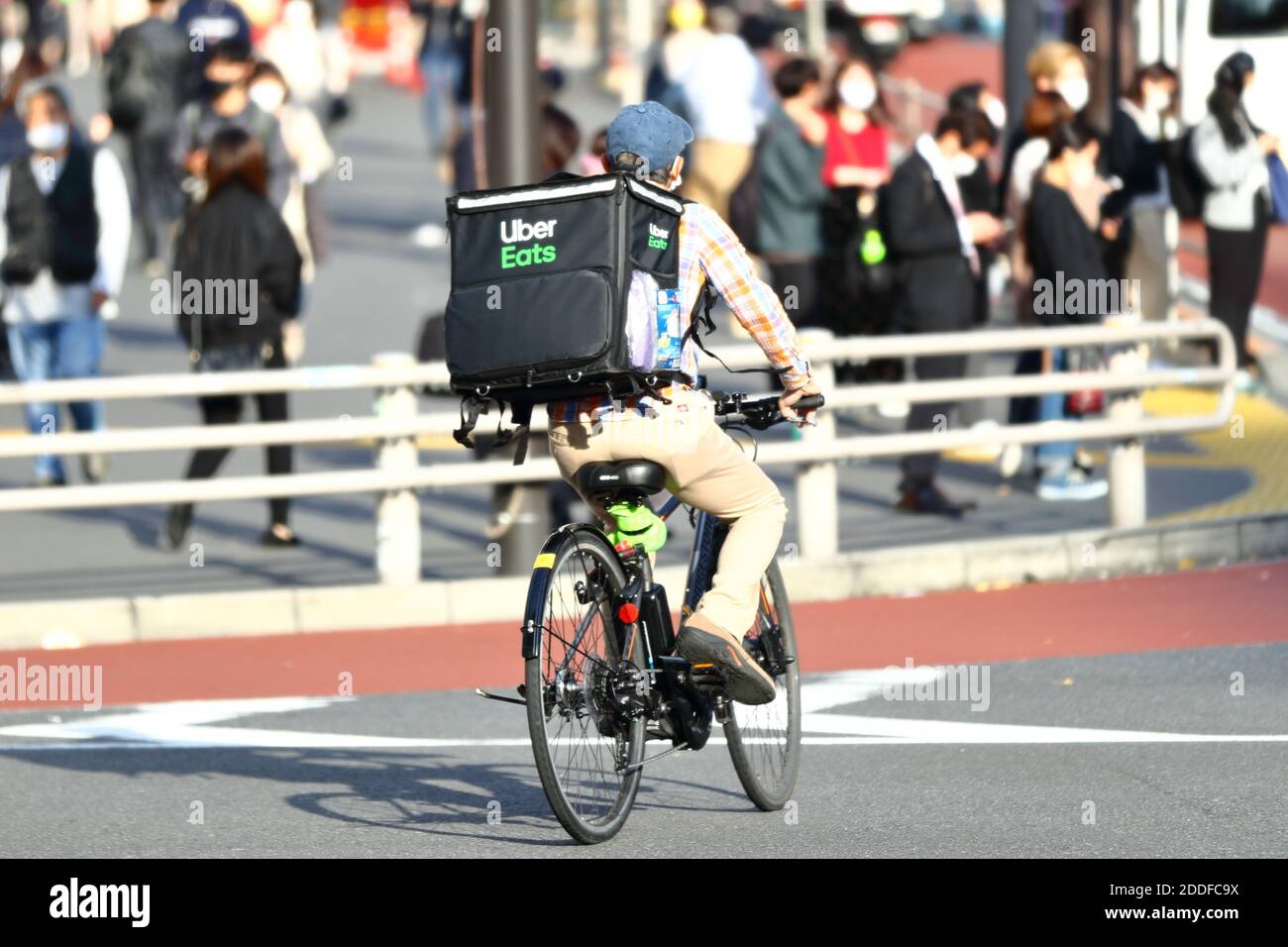 An Uber Eats food delivery courier is seen in Tokyo, Japan on November ...