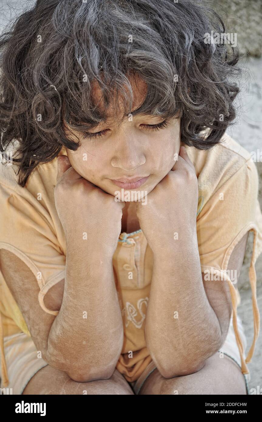 Poverty and poorness on the expression of children Stock Photo - Alamy