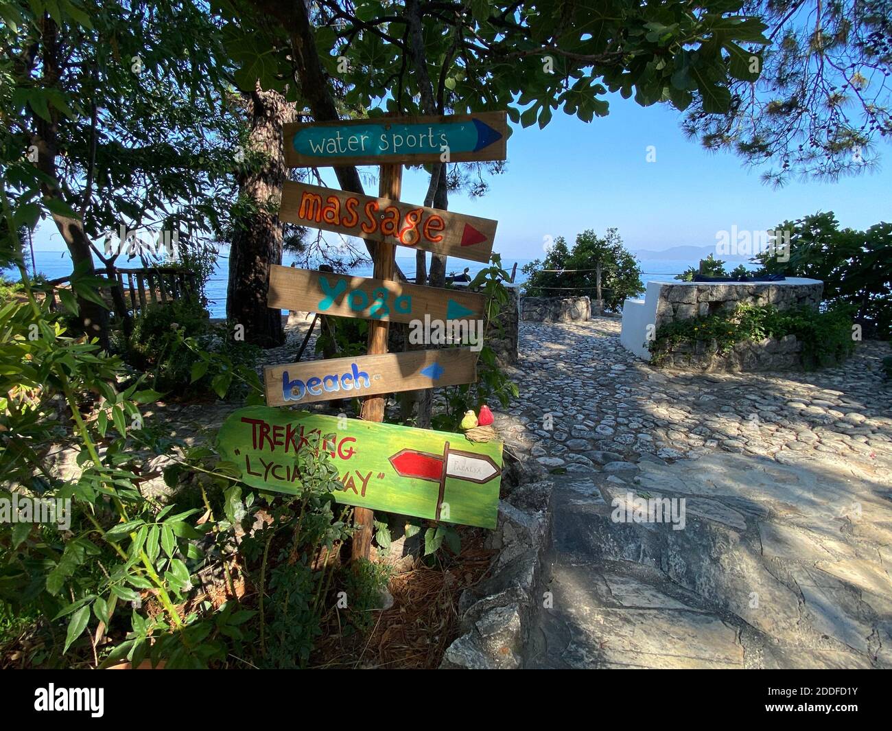 Pretty handmade outdoor signage showing different routes and directions ...