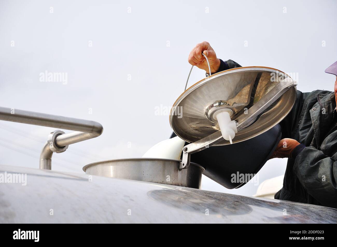 Collecting fresh milk with trucks Stock Photo - Alamy