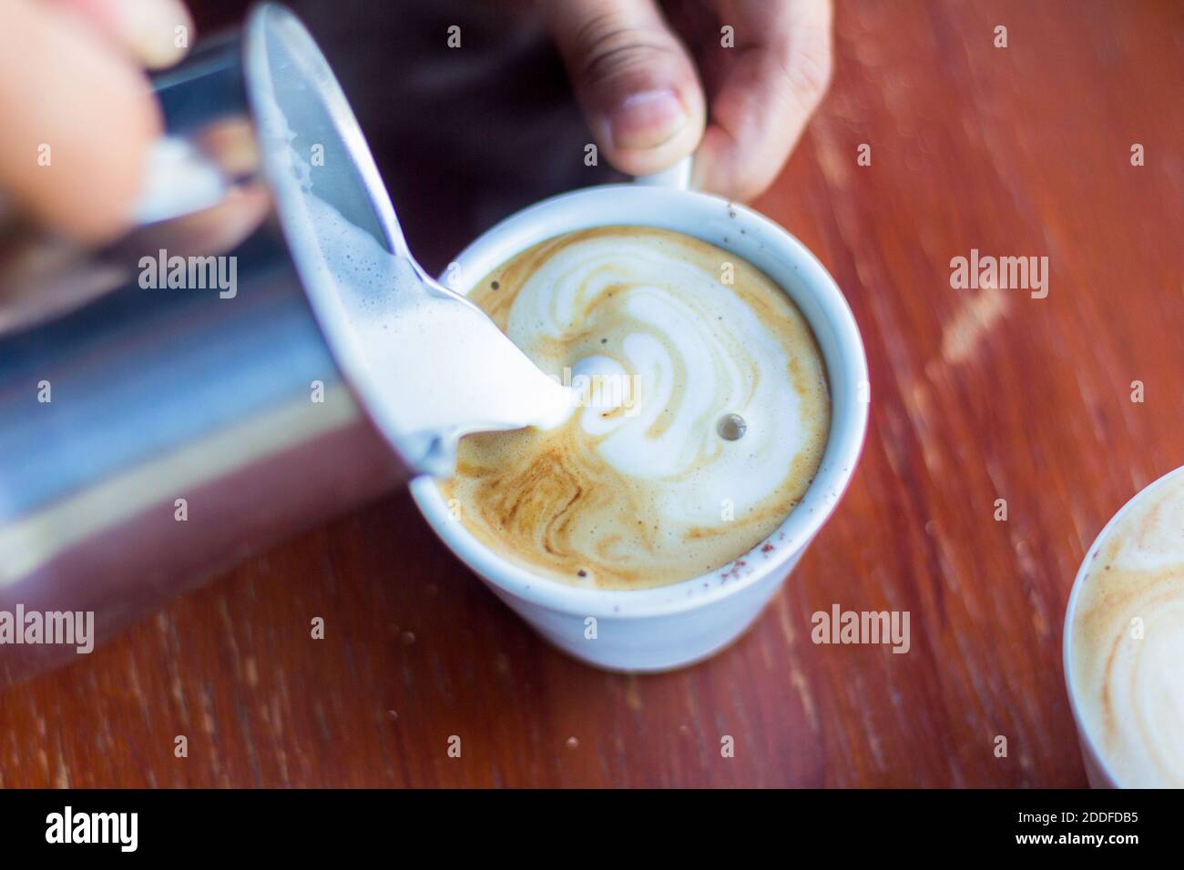 Latte coffee art at a local cafe in Bicol, Philippines Stock Photo - Alamy