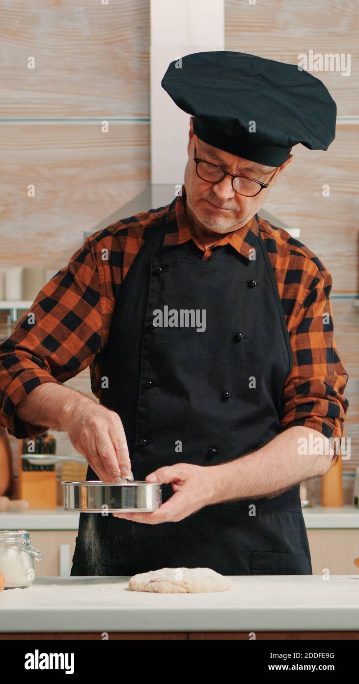 Retired baker man sieving hi-res stock photography and images - Alamy