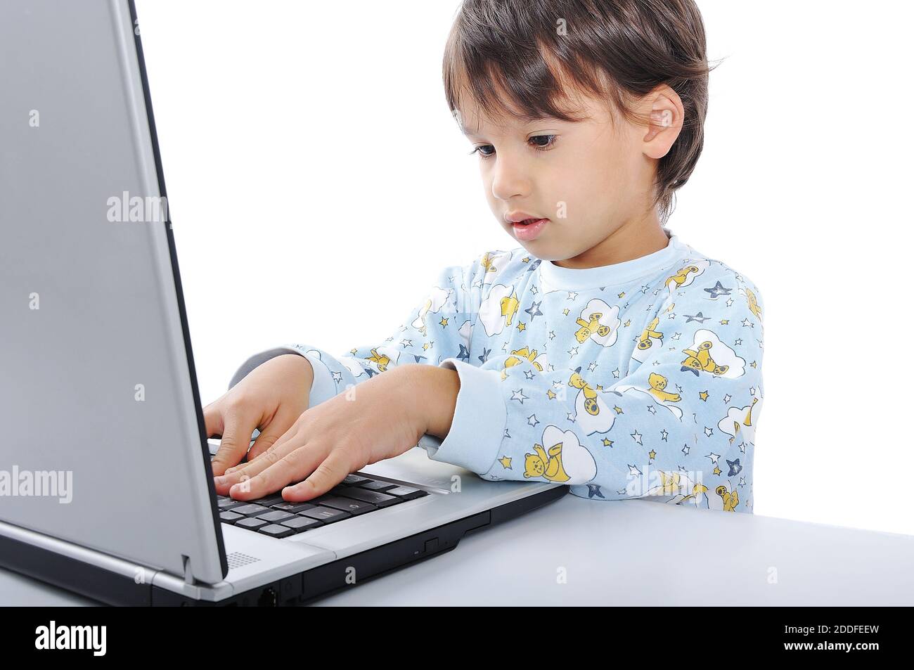 A little cute kid with a laptop isolated Stock Photo - Alamy