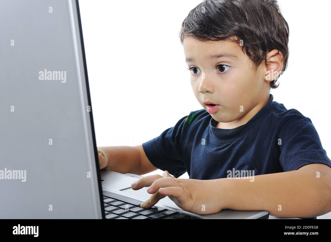 A little cute kid with a laptop isolated Stock Photo - Alamy