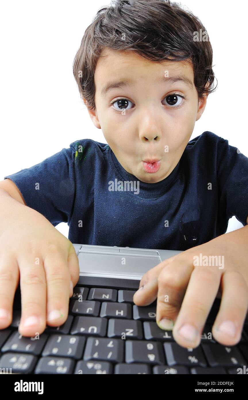 A little cute kid with a laptop isolated Stock Photo - Alamy