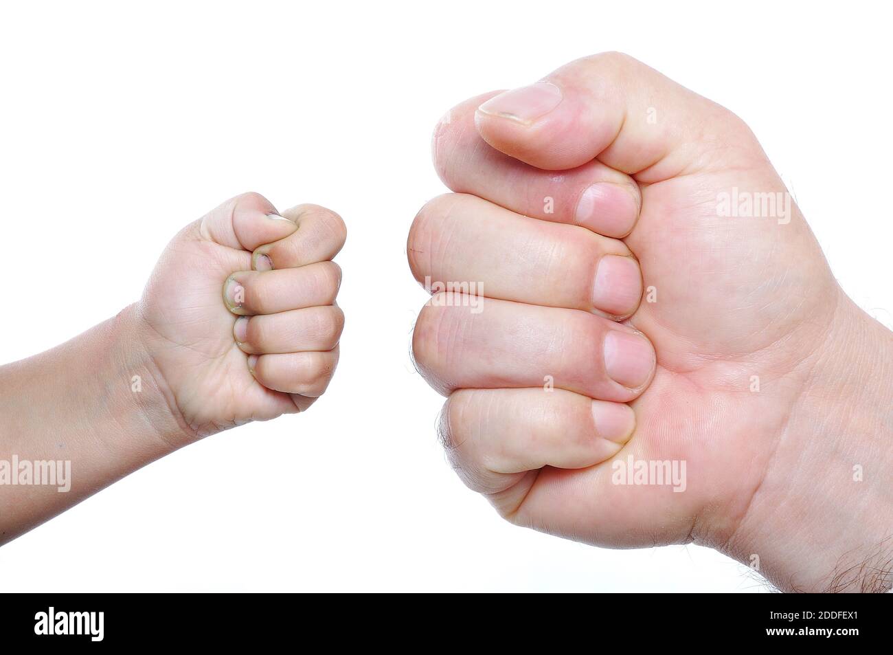 Two fists, big and small one Stock Photo - Alamy