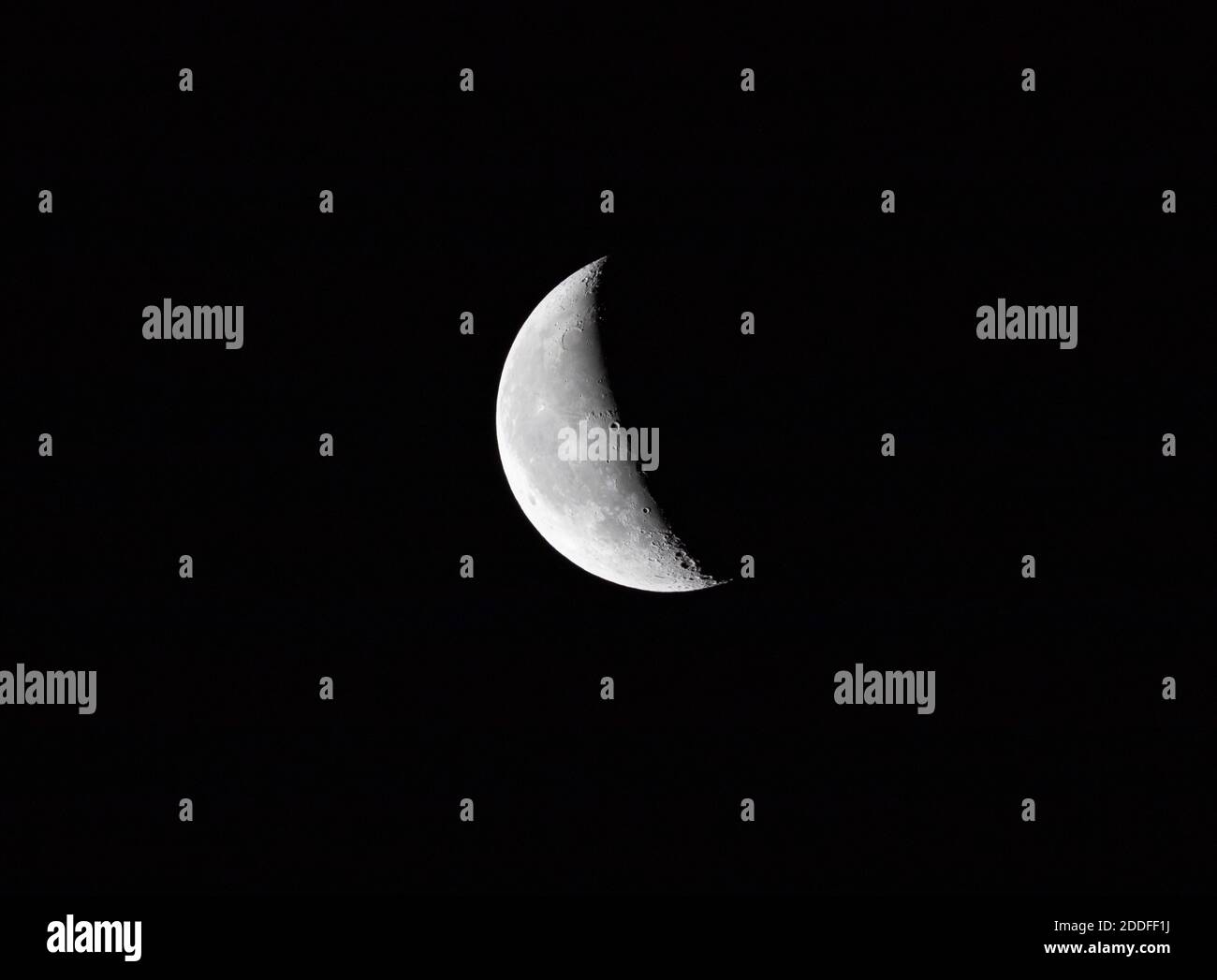 The quarter moon in the dark of the night sky Stock Photo - Alamy