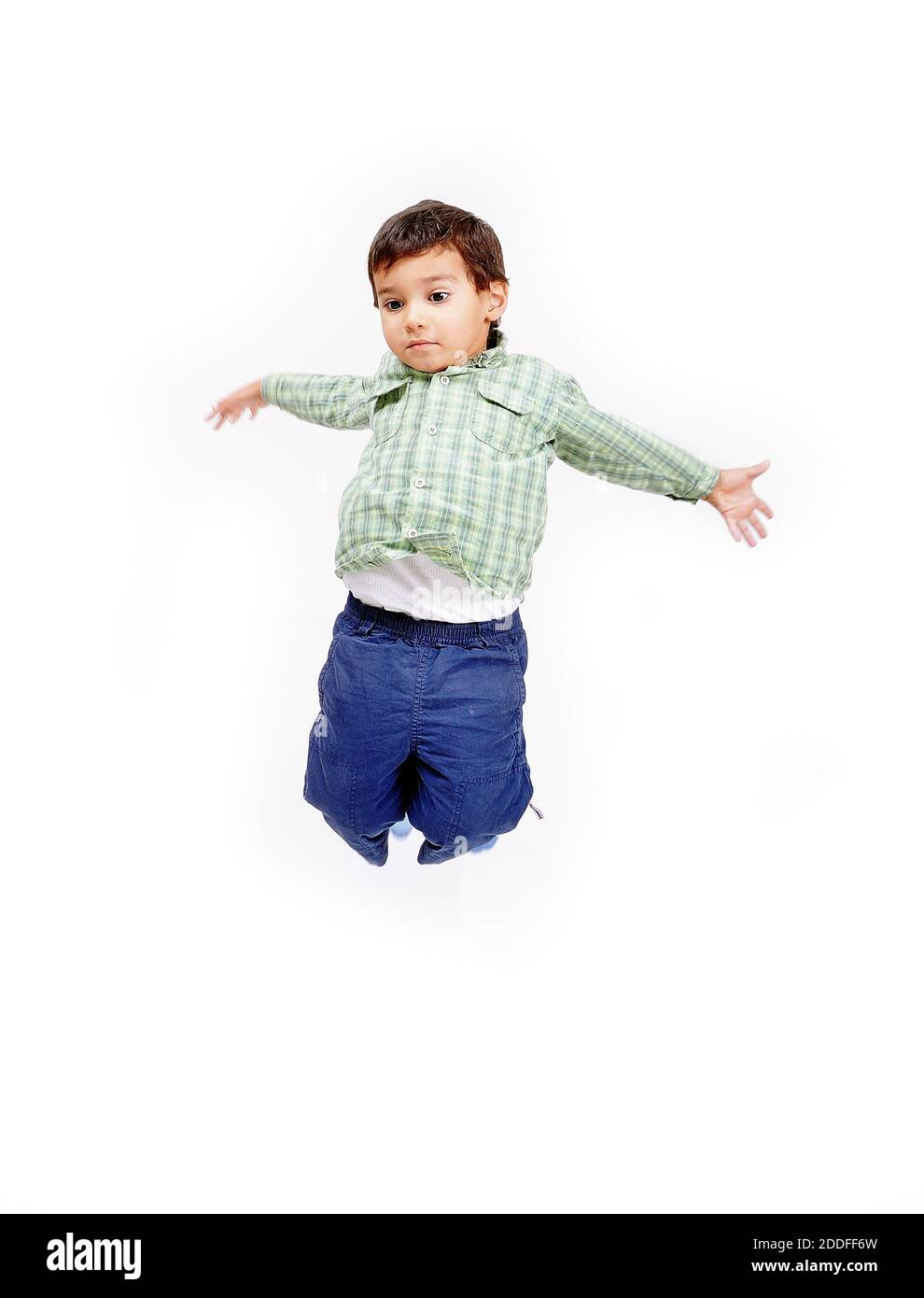 Very happy little cute child is jumping Stock Photo - Alamy