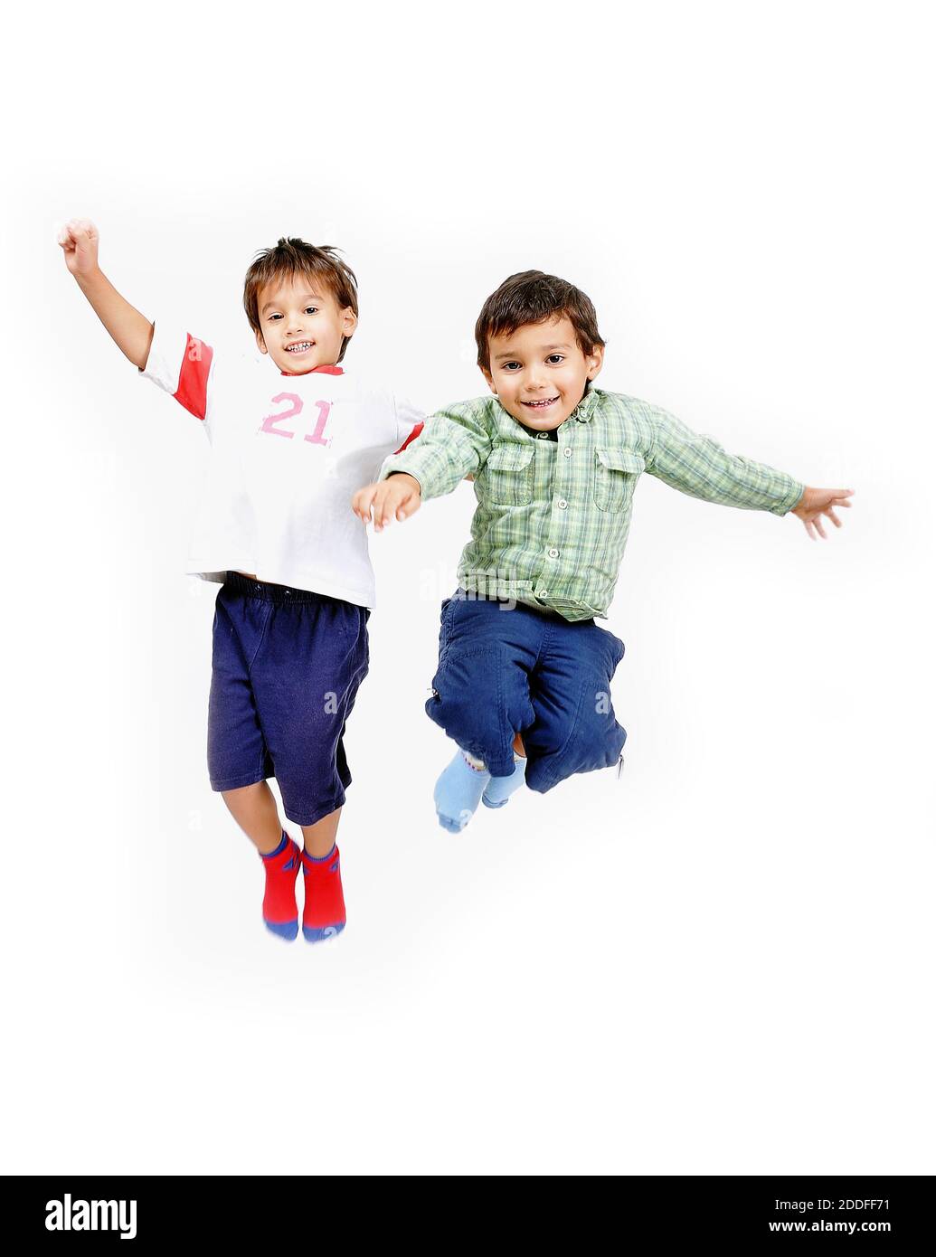 Very happy two little cute children jumping Stock Photo - Alamy