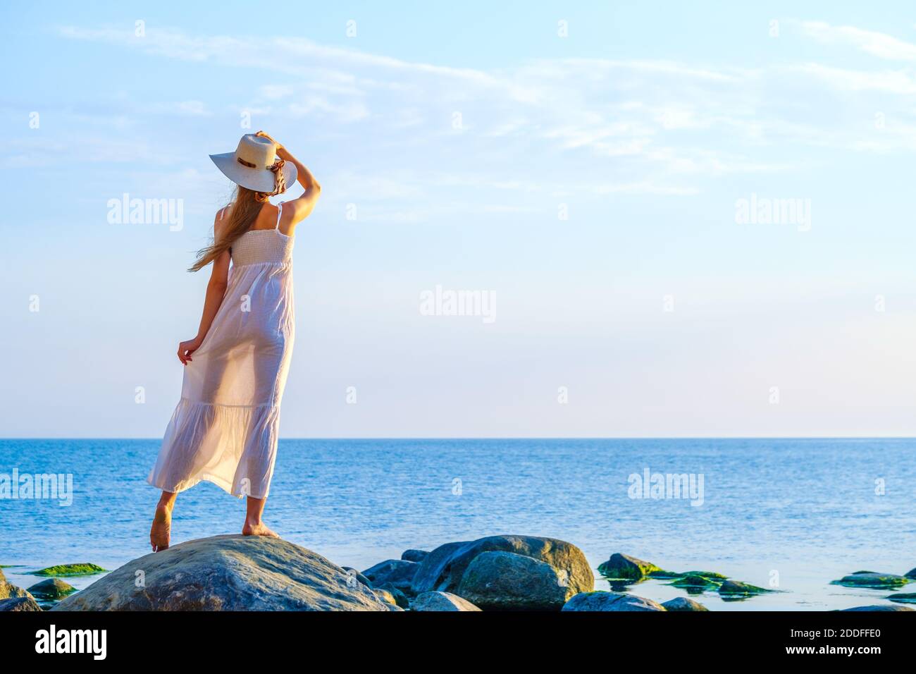 Woman back view seaside hi-res stock photography and images - Alamy