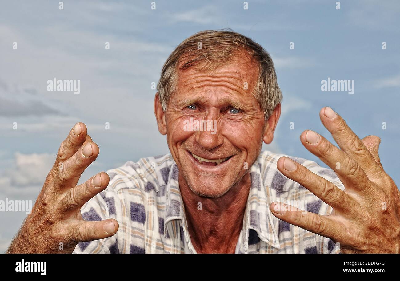 Middle aged male person with interesting gestures Stock Photo - Alamy