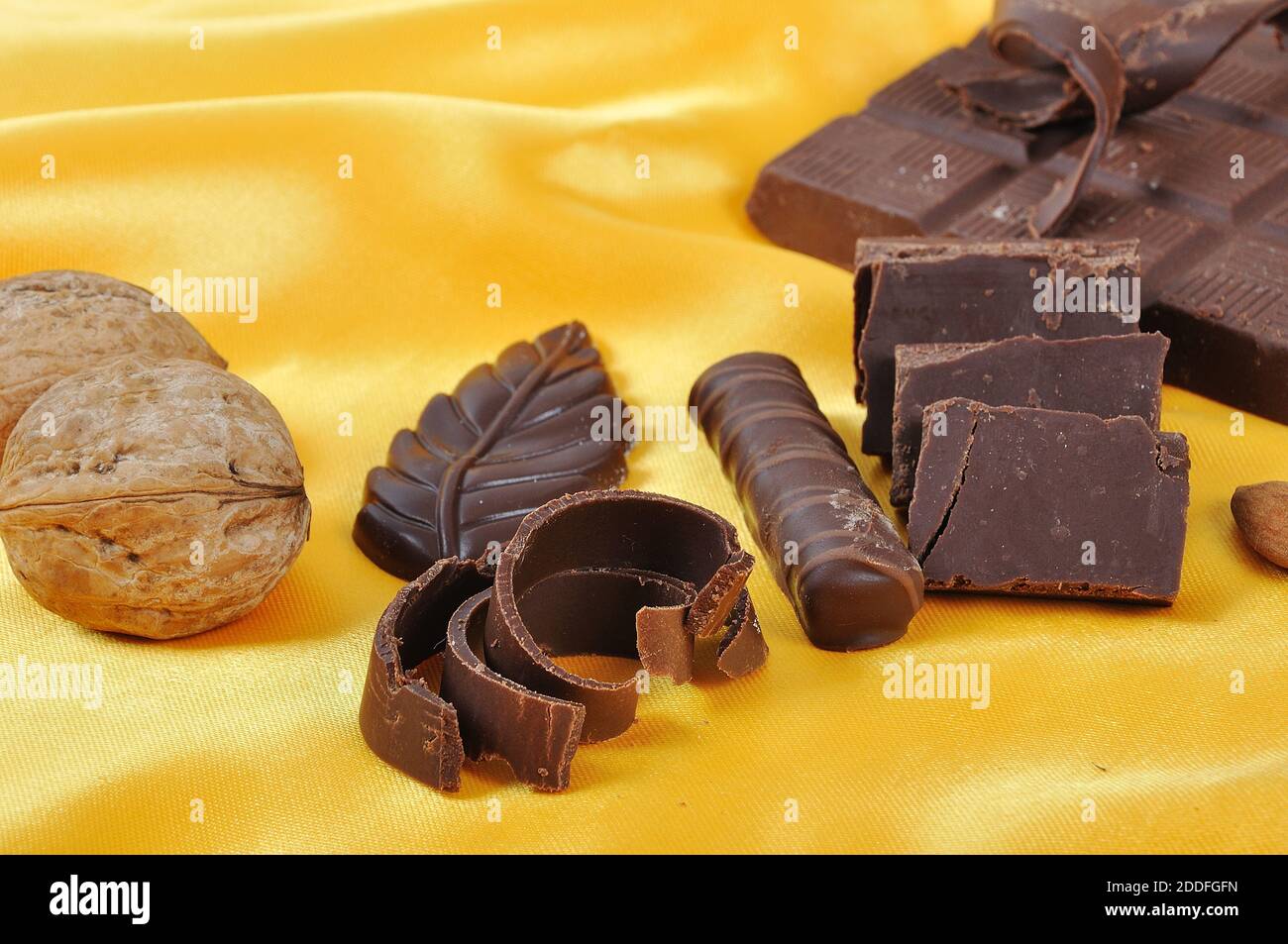 Chocolate, table, pieces, on golden background Stock Photo - Alamy
