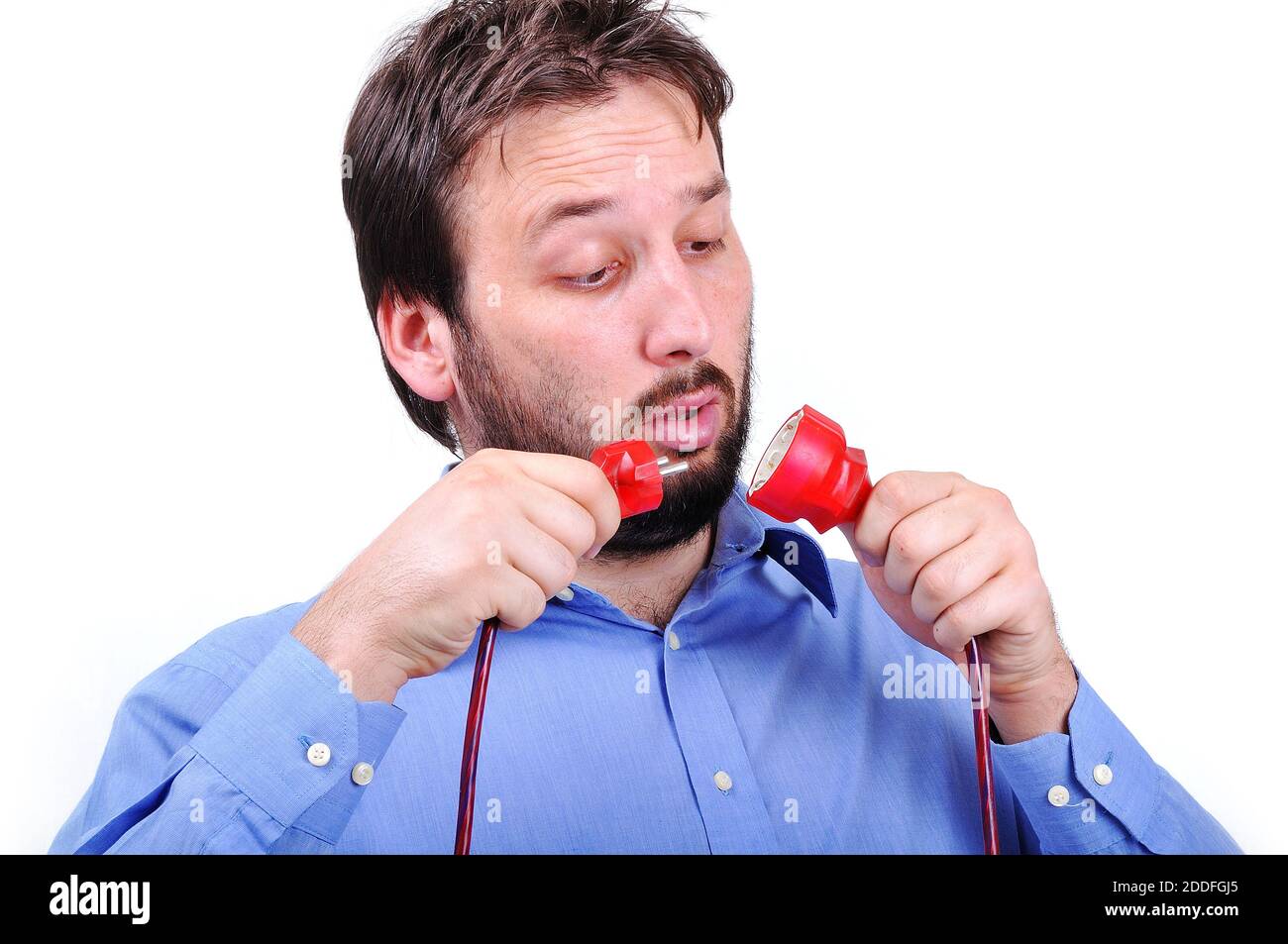 Young attractive man with electricity plug Stock Photo - Alamy