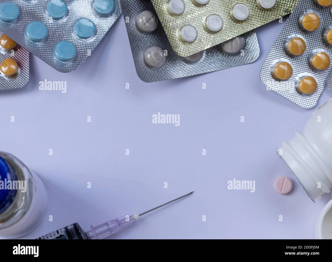top view of injection syringe, bottle and tablets on white background ...