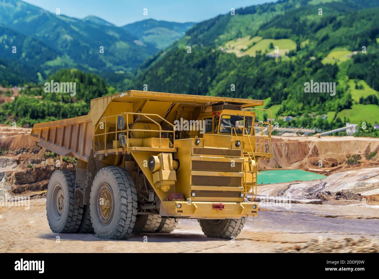 Yellow mining truck in iron ore in Austria Stock Photo - Alamy