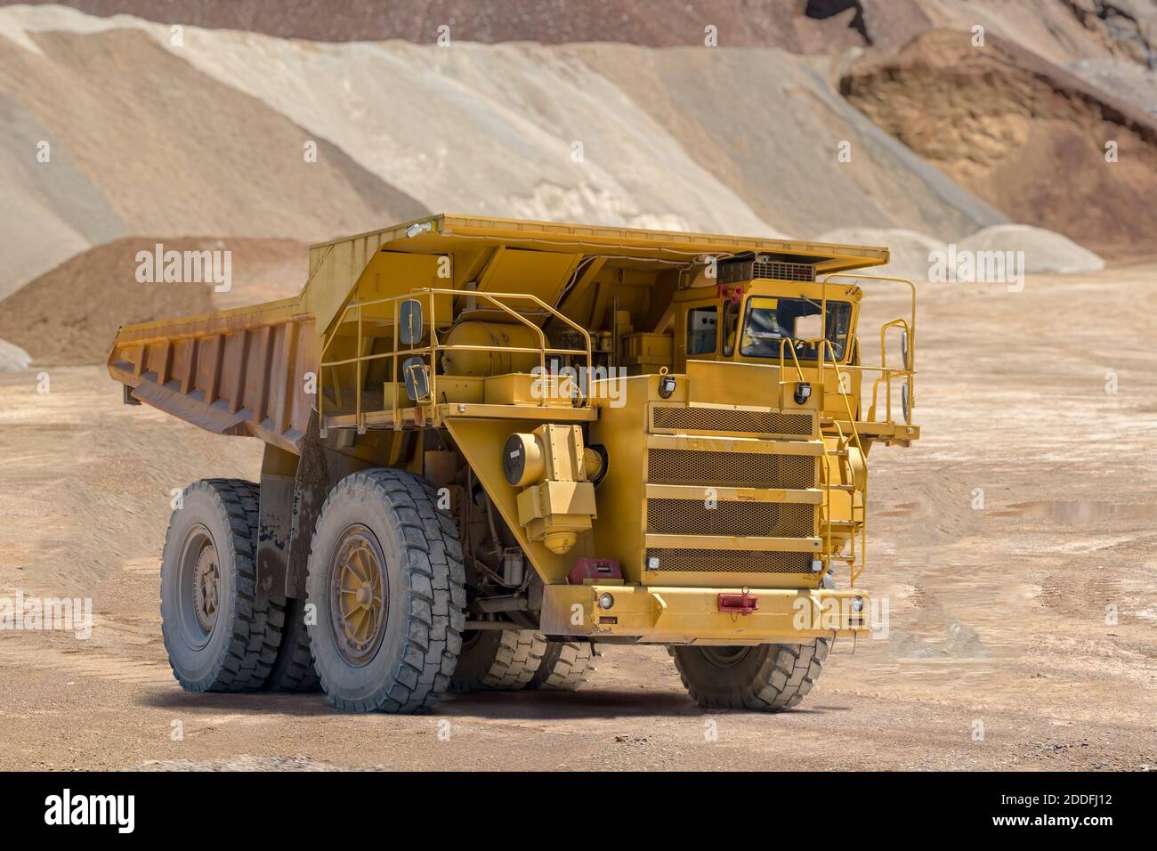 Yellow mining truck in iron ore in Austria Stock Photo - Alamy