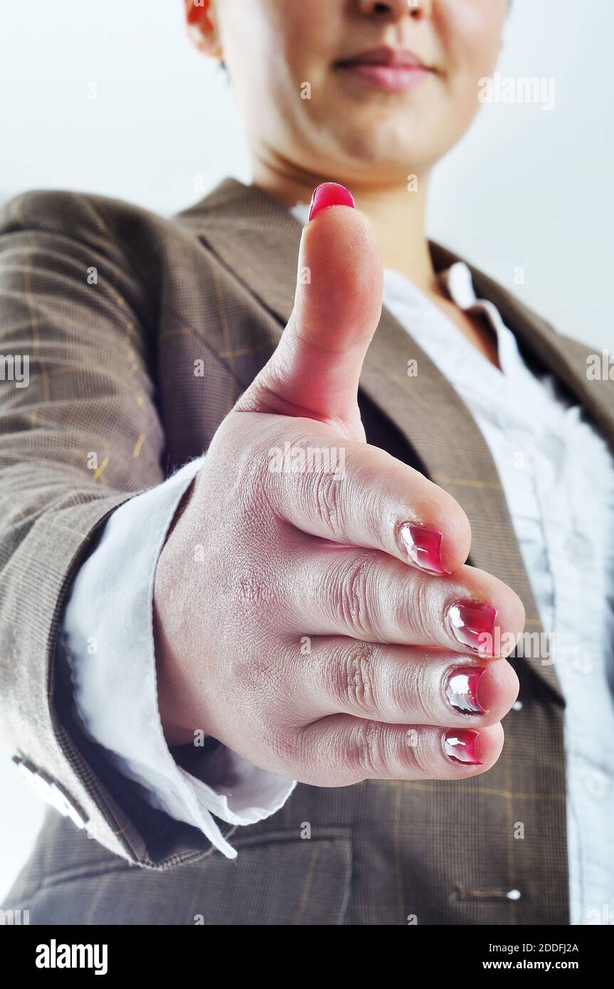 Woman giving a hand for shaking Stock Photo - Alamy