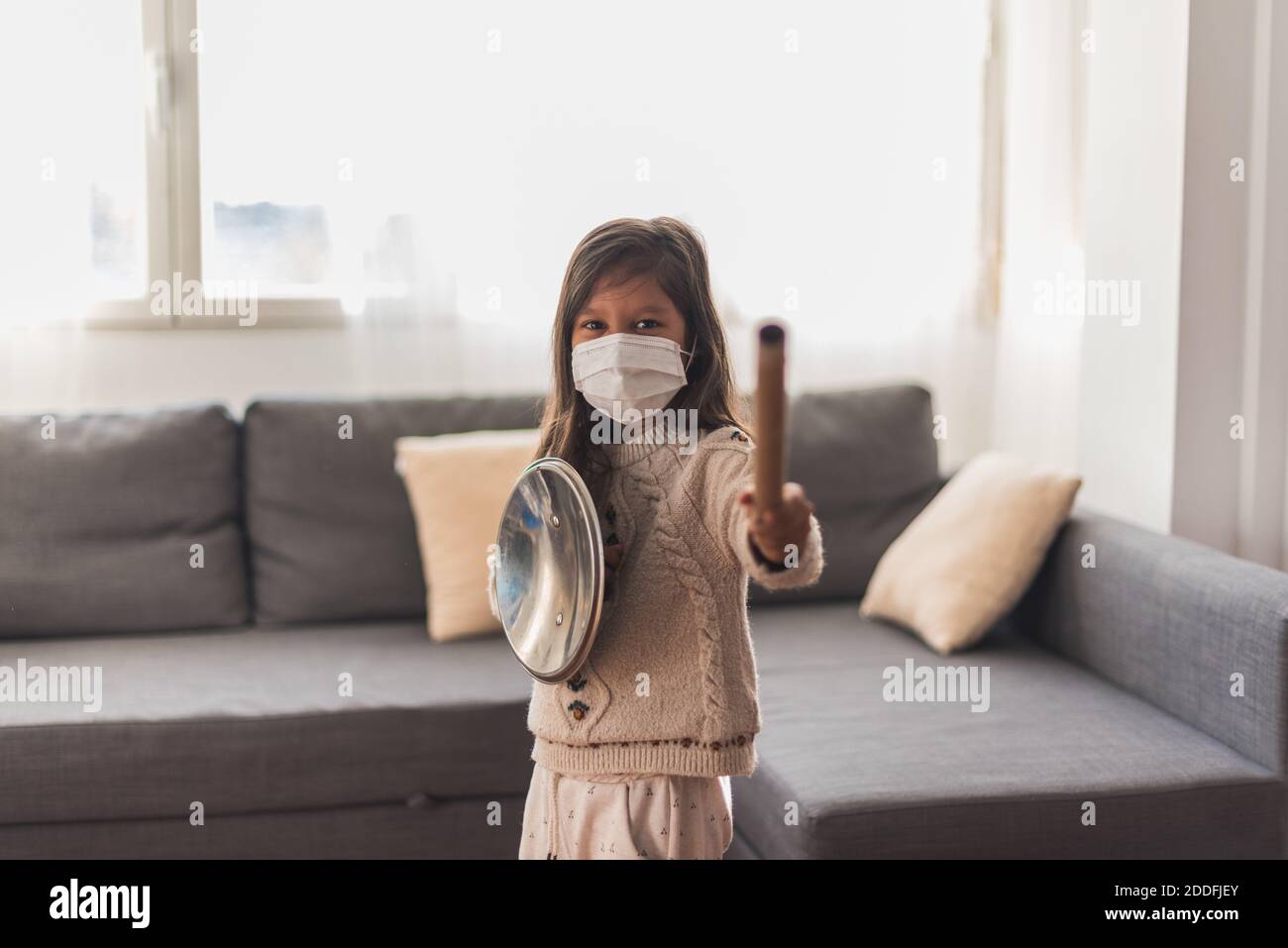 A little girl playing with a fake armor Stock Photo - Alamy
