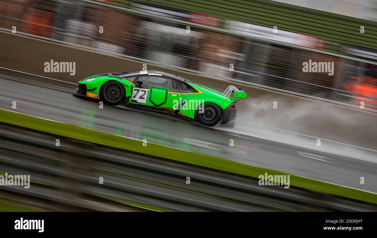 A panning shot of a racing car as it circuits a track Stock Photo - Alamy
