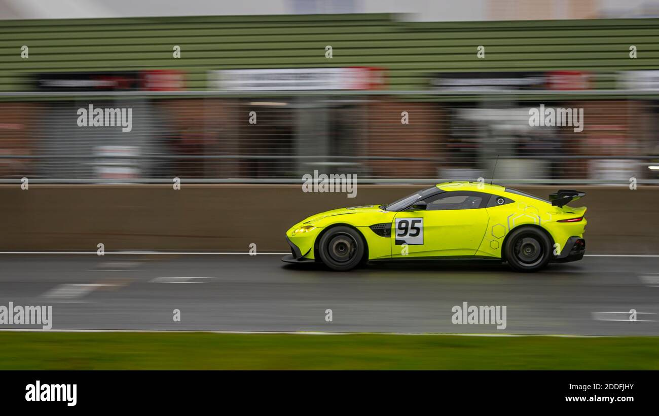 A panning shot of a racing car as it circuits a track Stock Photo - Alamy