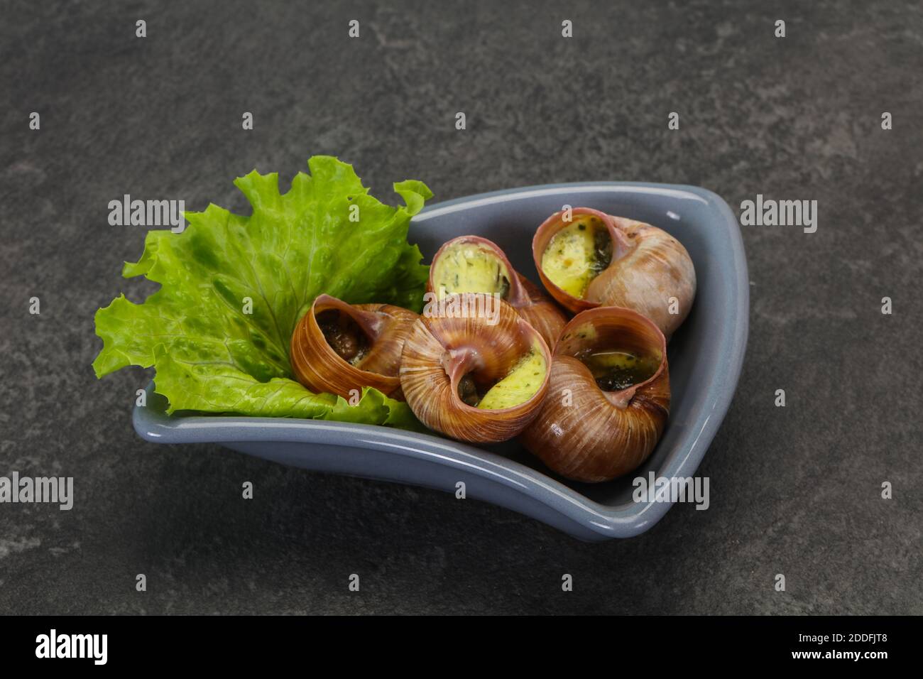 French cuisine - Escargot with butter sauce Stock Photo - Alamy