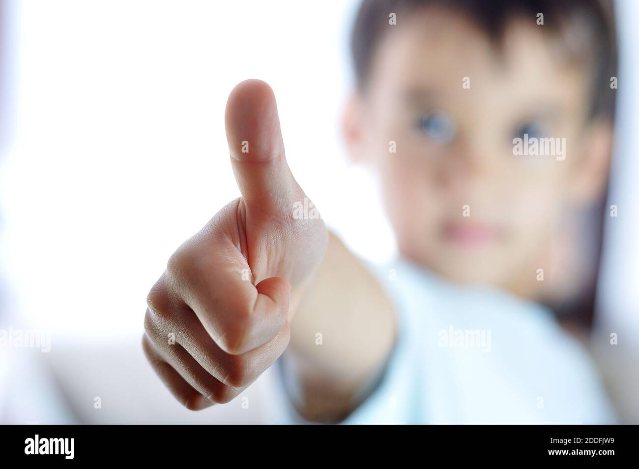 Kid with thumb up Stock Photo - Alamy
