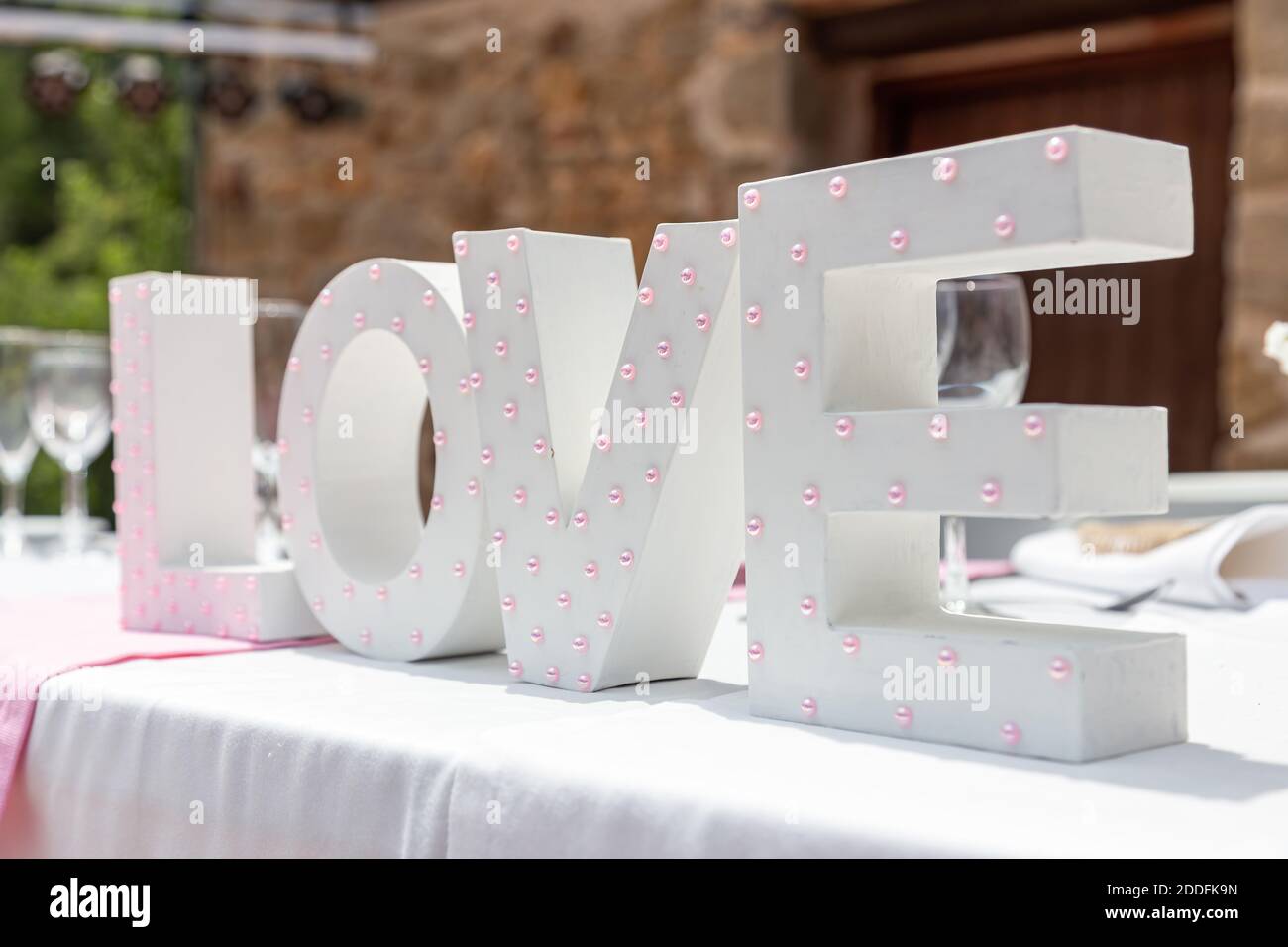 Romantic love decoration on a cozy wedding table Stock Photo - Alamy
